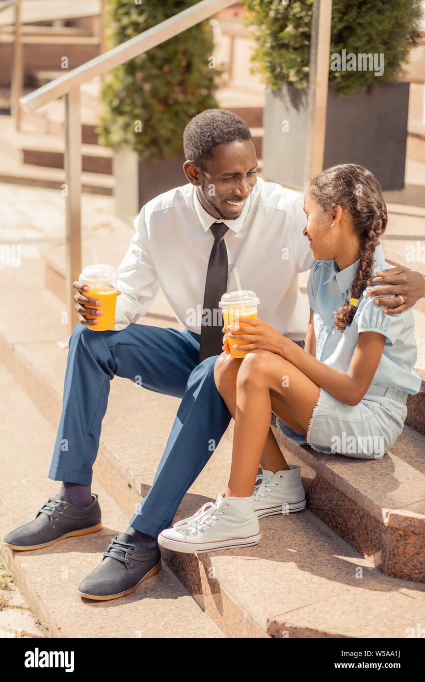 Handsome father having pleasant conversation with his child Stock Photo ...