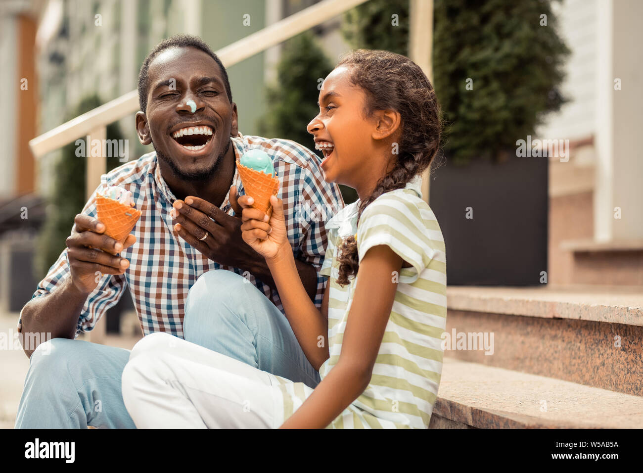 Amazing little female laughing at her daddy Stock Photo - Alamy