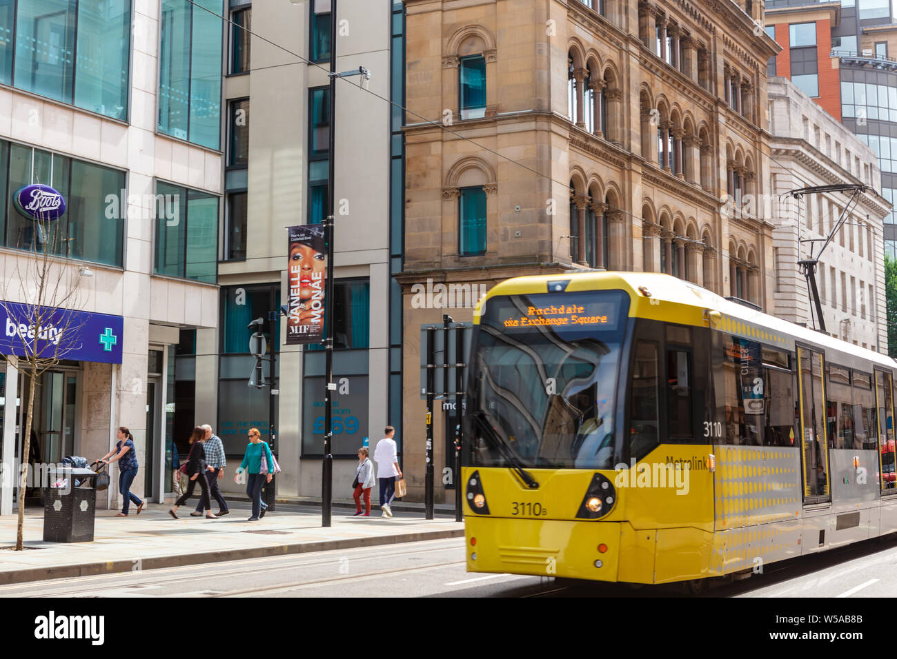 Yellow tram of Manchester Metrolink in city centre Stock Photo - Alamy