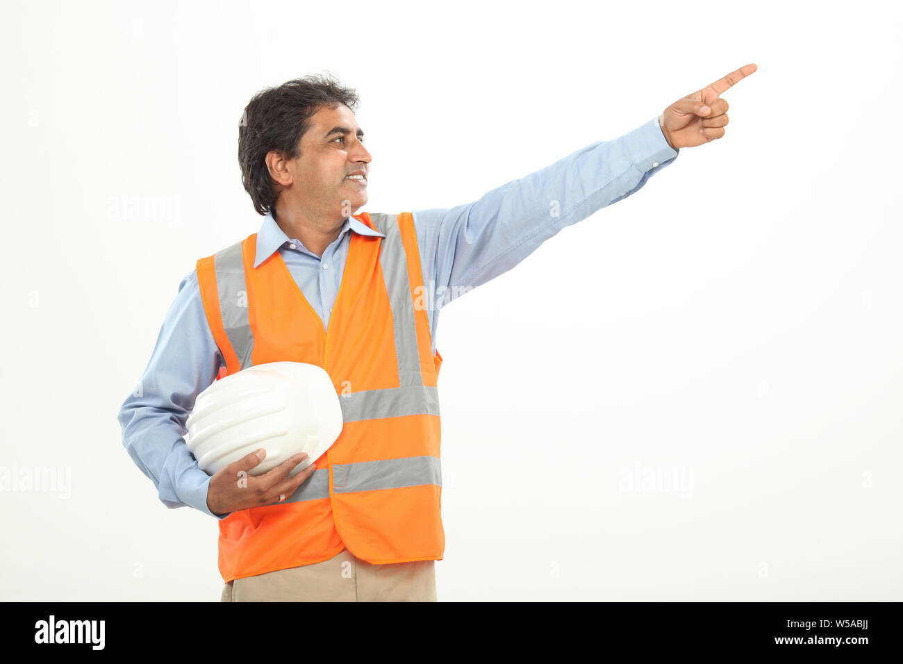 Architect pointing and smiling Stock Photo - Alamy