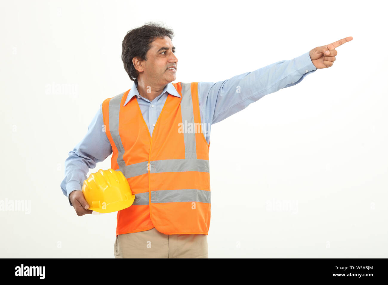 Architect pointing and smiling Stock Photo - Alamy