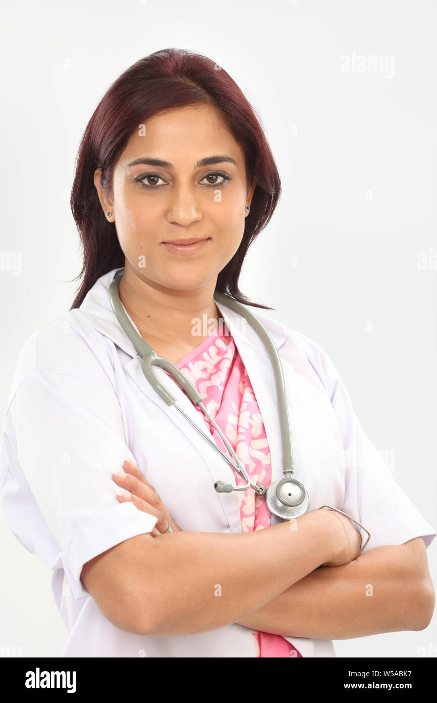 Portrait of a female doctor with her arms crossed Stock Photo - Alamy