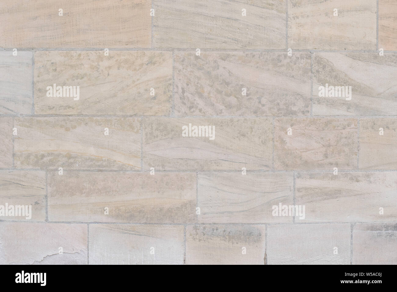 beige sandstone wall as background Stock Photo - Alamy