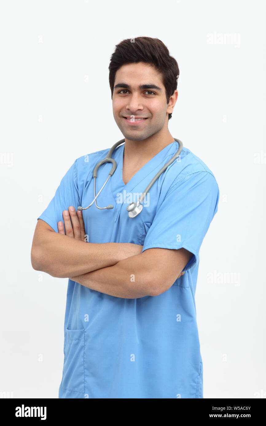 Surgeon smiling with his arms crossed Stock Photo - Alamy