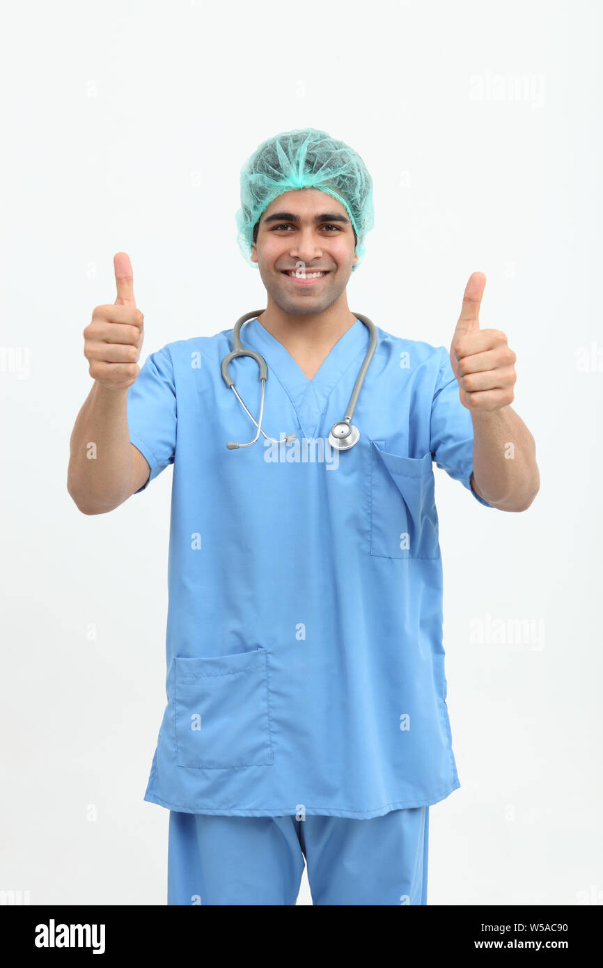 Male surgeon showing thumbs up sign Stock Photo - Alamy