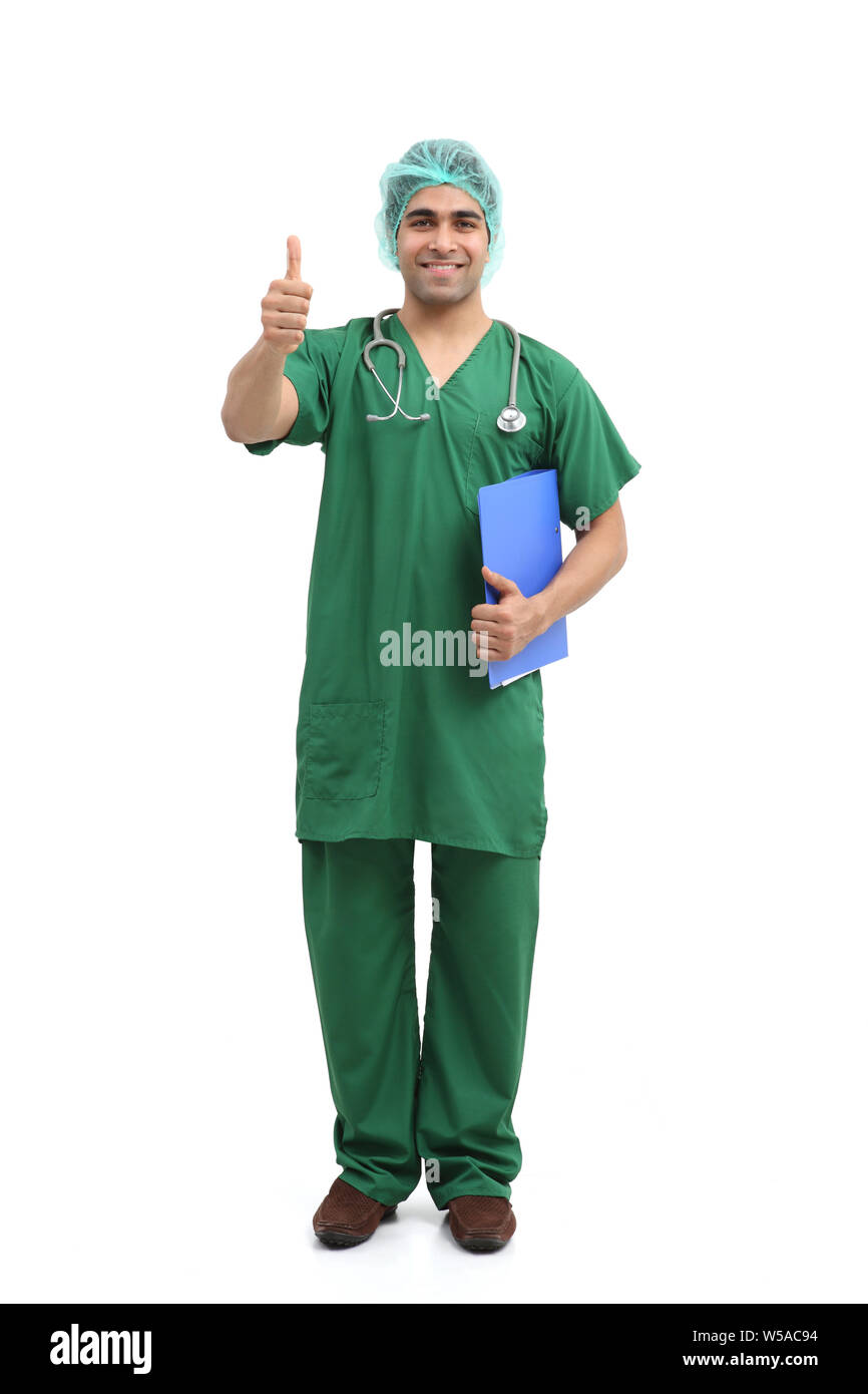 Male surgeon holding medical report and showing thumbs up sign Stock ...