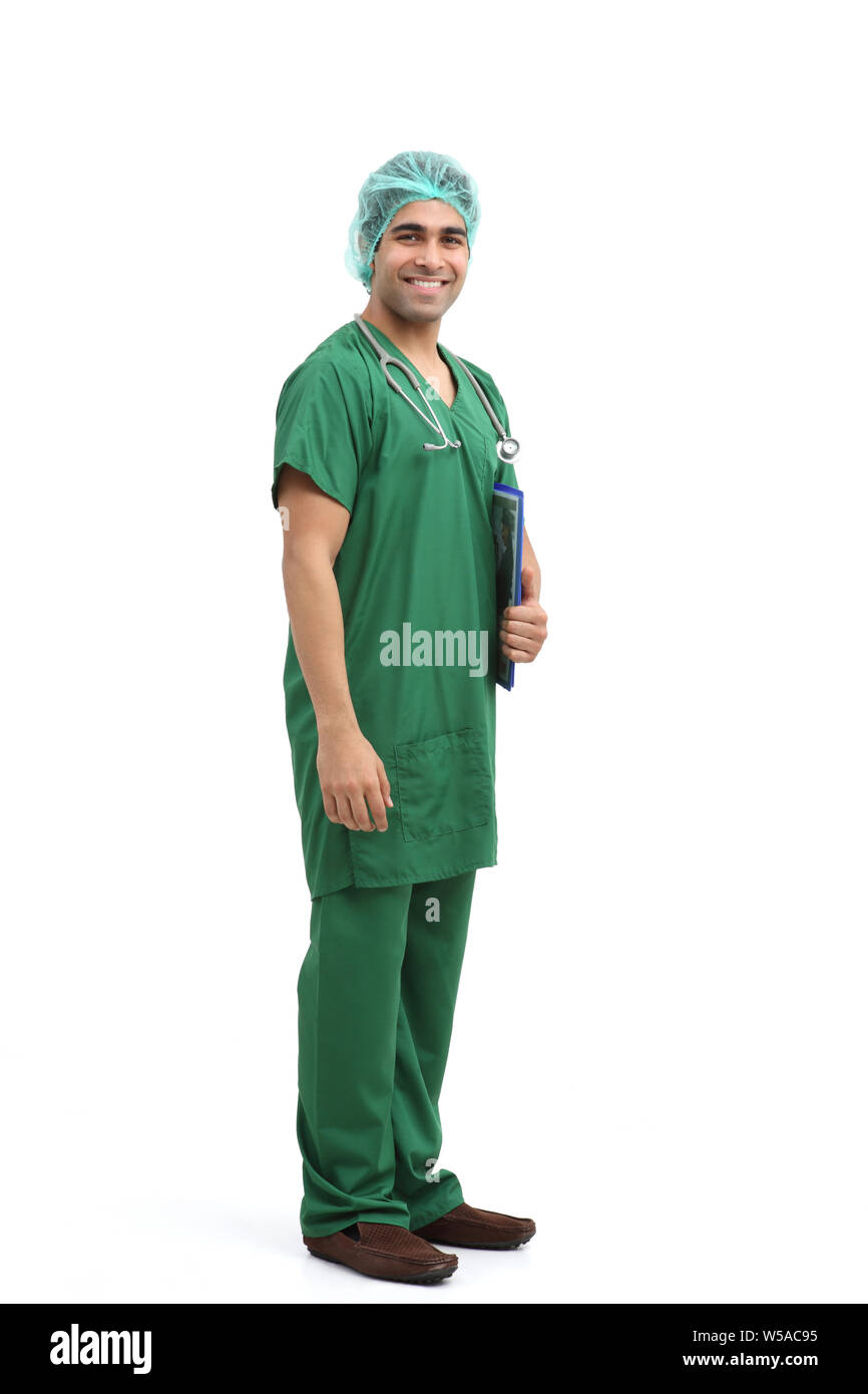 Indian male surgeon holding file and smiling Stock Photo - Alamy