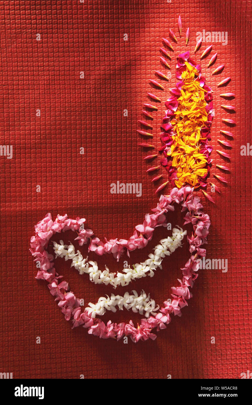 Diya symbol made of flowers Stock Photo - Alamy