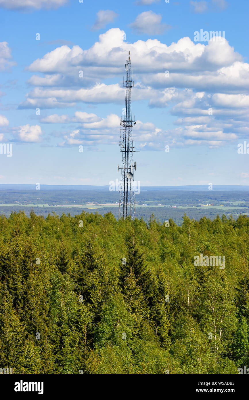 Communication mast in a forest and landscape view Stock Photo - Alamy