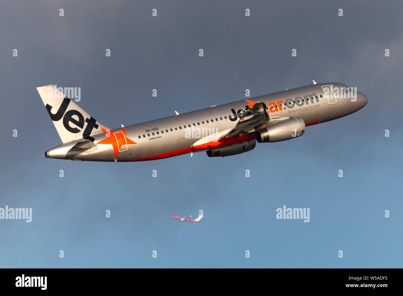 Jetstar Airways Airbus A320 twin engine passenger aircraft climbing on ...