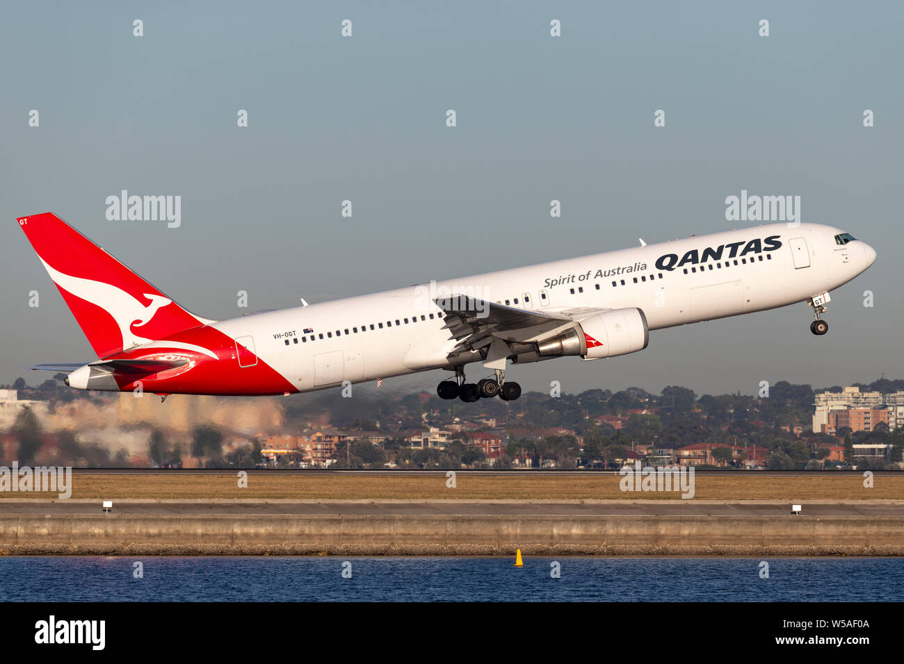 Qantas Boeing 767 airliner taking off from Sydney Airport Stock Photo ...