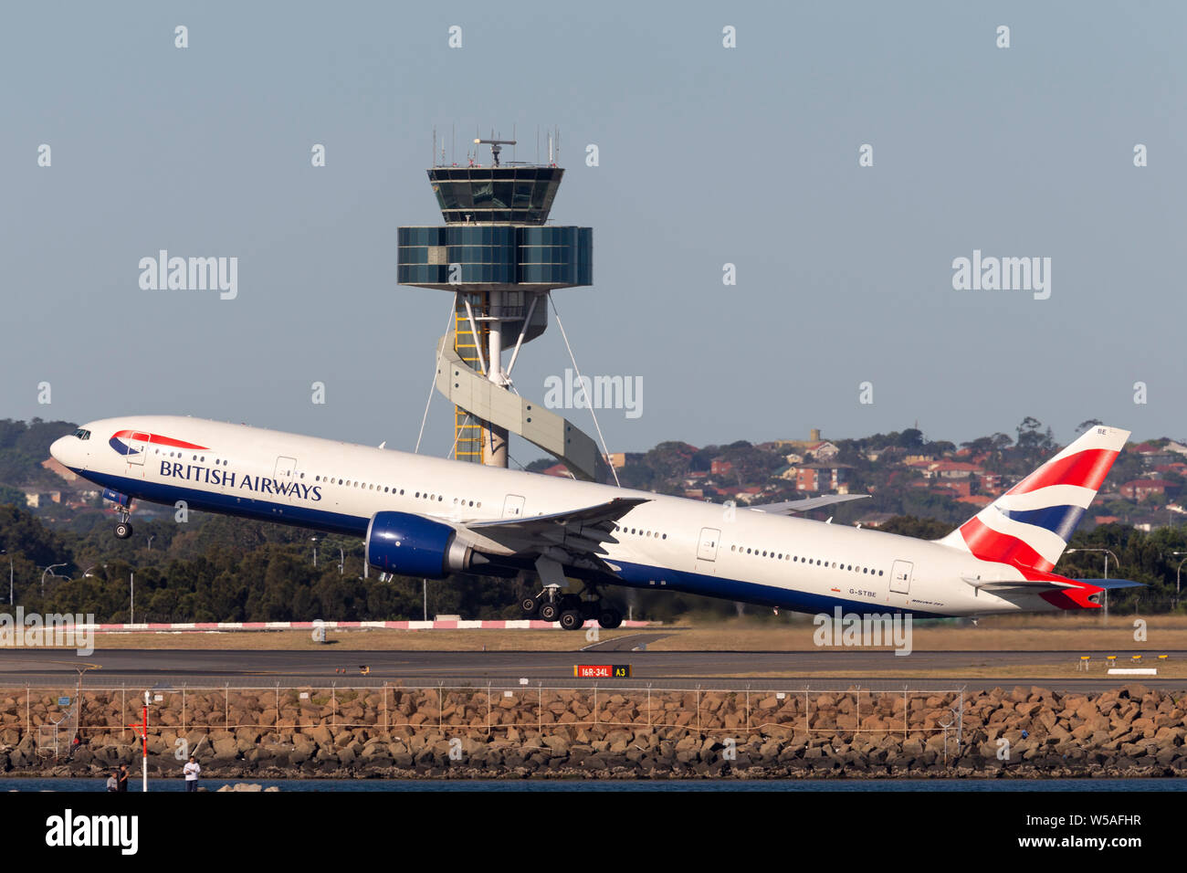 British Airways Boeing 777 large commercial airliner taking off in ...