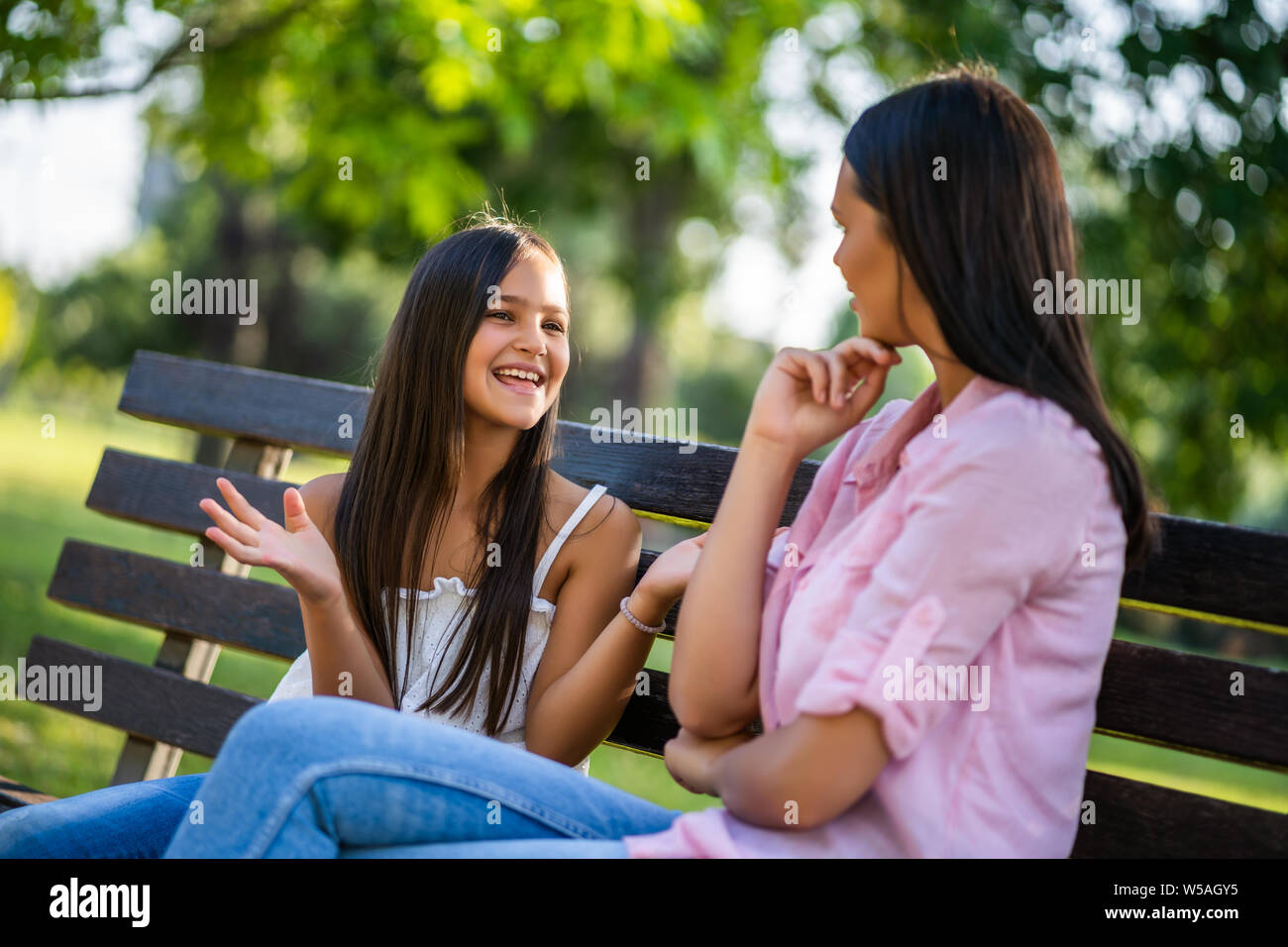 Happy family having nice time in park together Stock Photo - Alamy