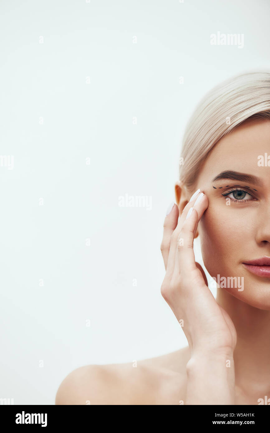 Plastic Surgery Operation. Cropped photo of pretty and young blonde ...