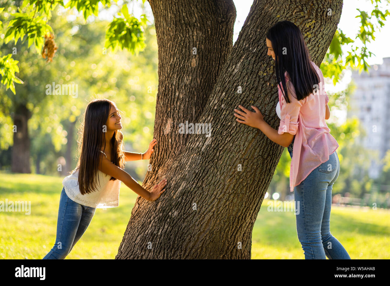 Happy family having nice time in park together Stock Photo - Alamy