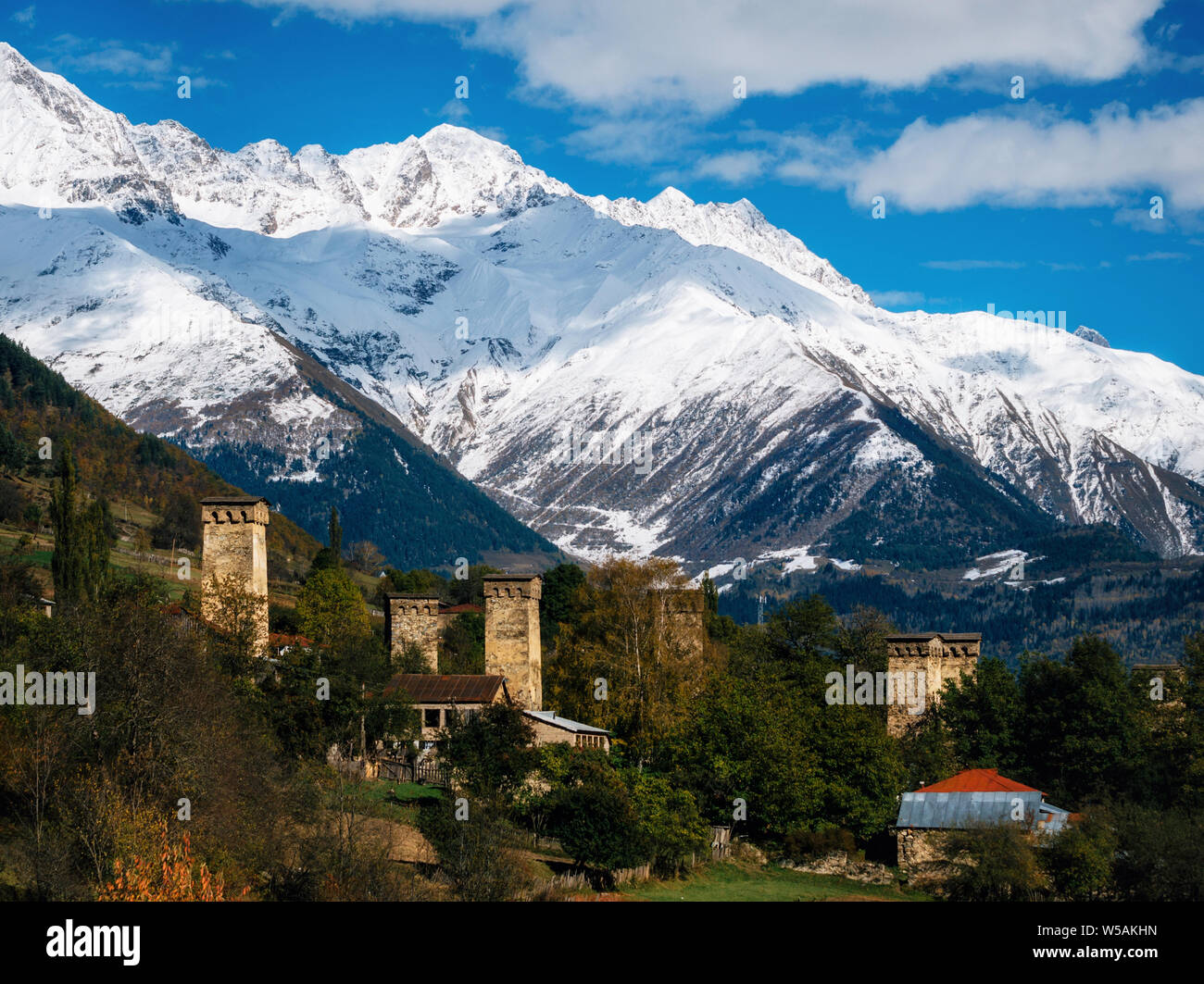 View of the Svanetian towers in Mestia village against mountains with ...