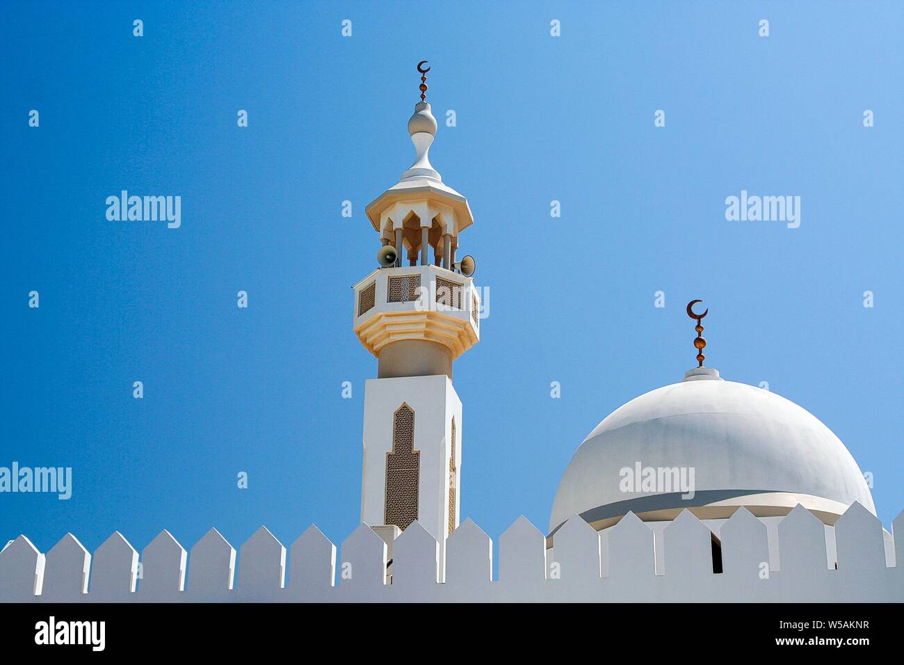 Symbols of Islam: White dome and Minarette with islamic crescent moon ...