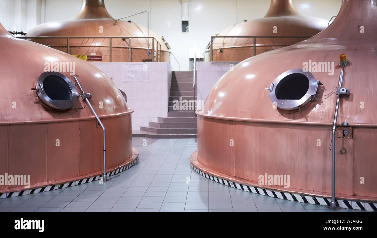 Equipment for preparation of beer. Lines of cooper tanks in brewery ...