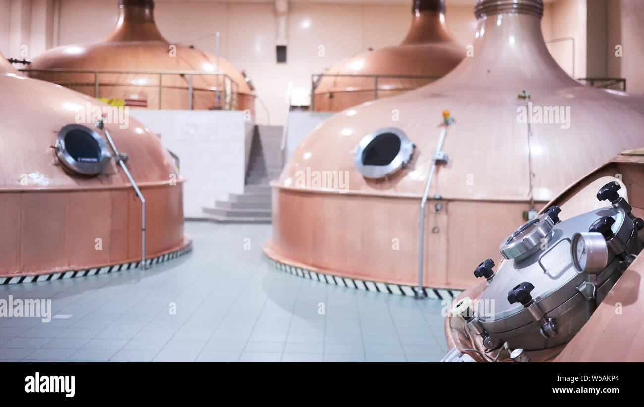 Equipment for preparation of beer. Lines of cooper tanks in brewery ...