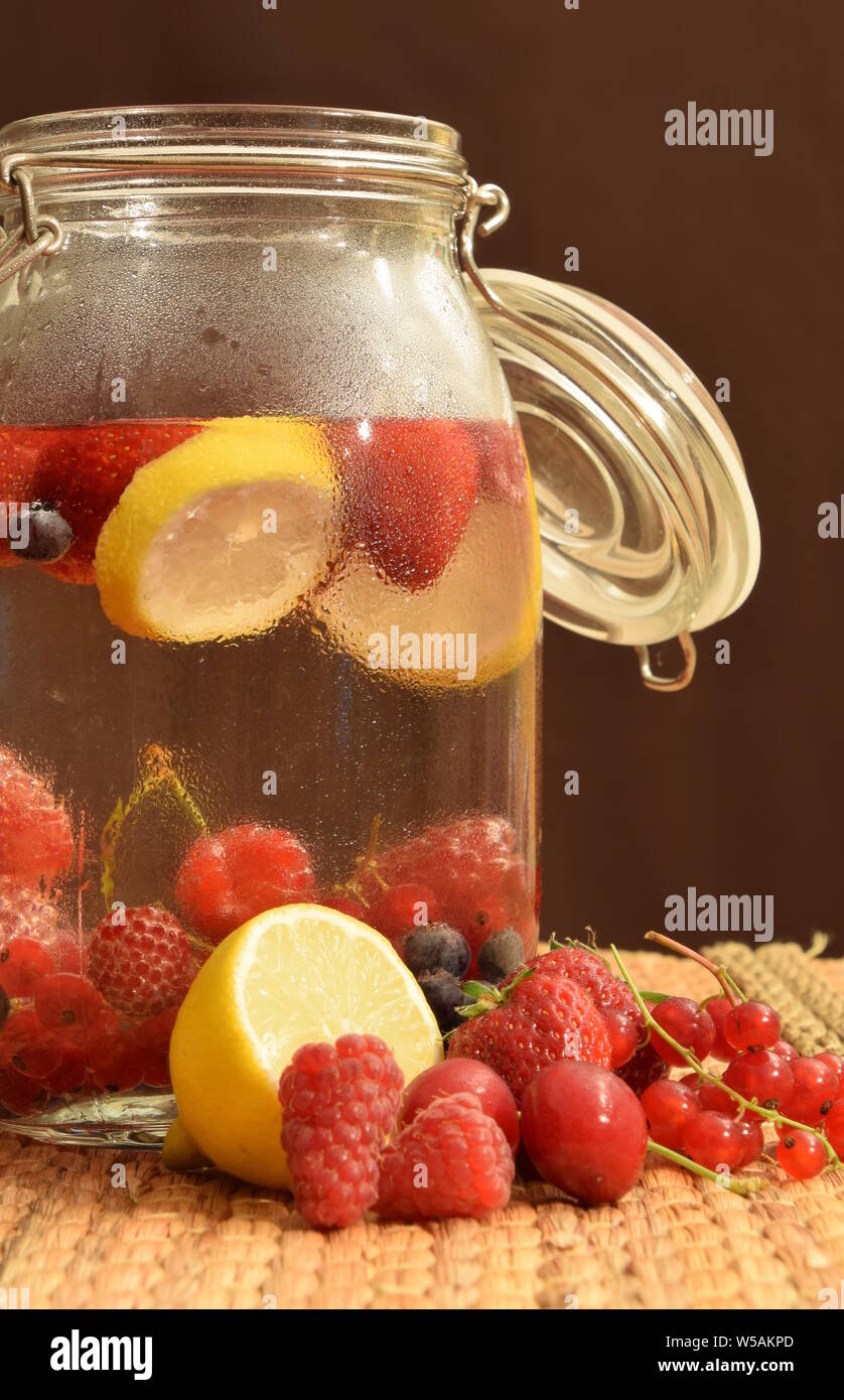 Refreshing Cold vitalwater with seasonal fruits Stock Photo - Alamy
