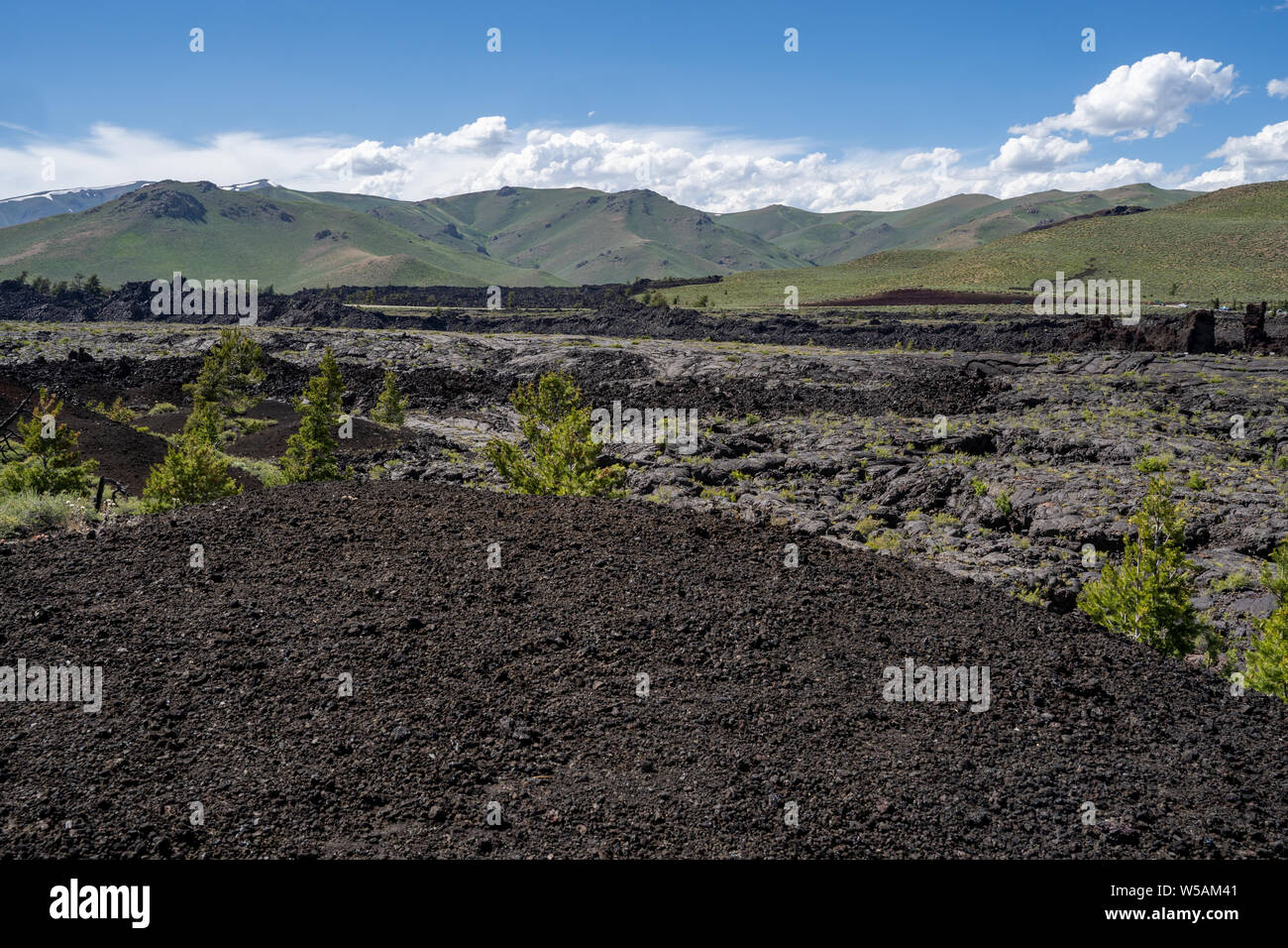 Black volcanic rock and lava flow fields in Craters of the Moon ...