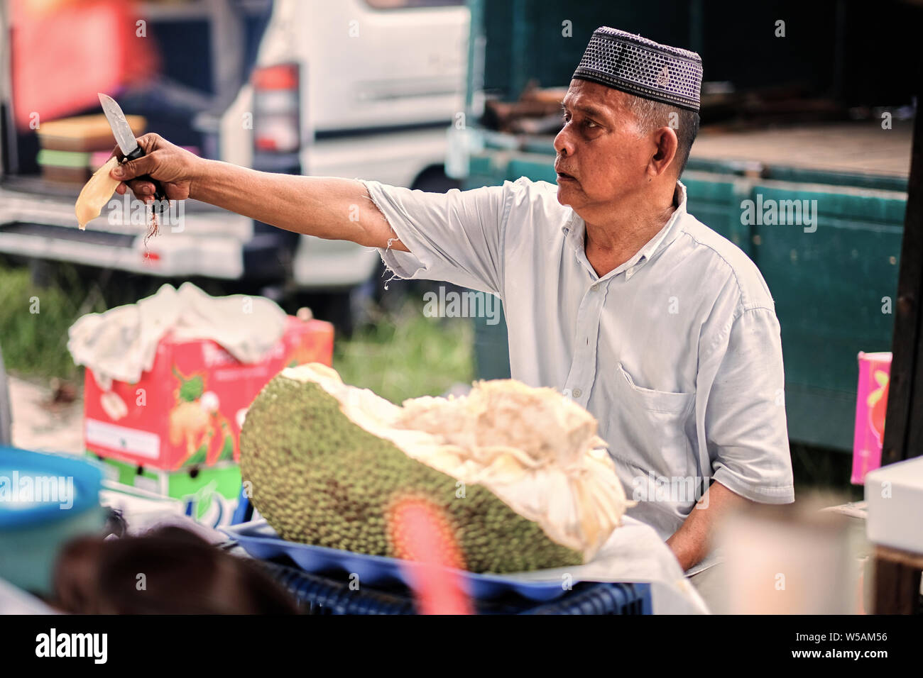 Langkawi, Malaysia - Jul, 2019: Asian man preparing jackfruit. Old ...