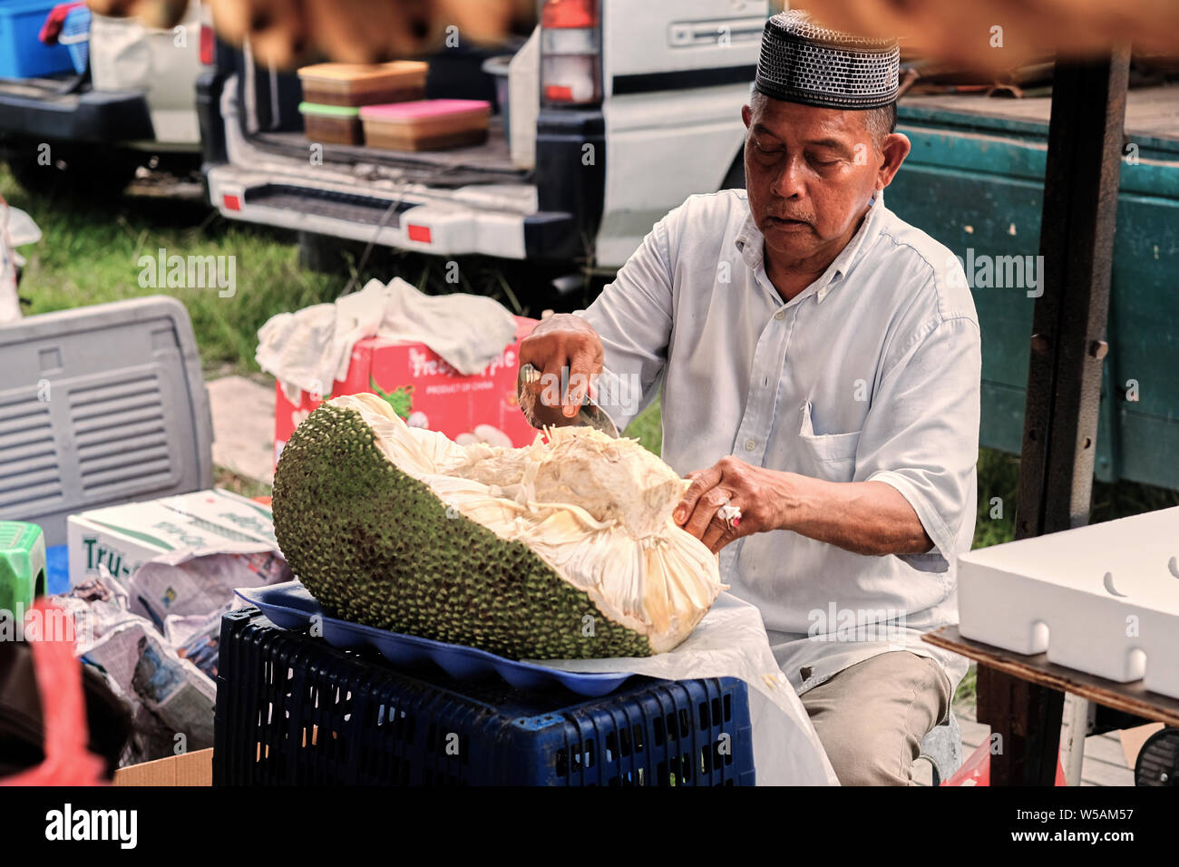 Langkawi, Malaysia - Jul, 2019: Asian man preparing jackfruit. Old ...