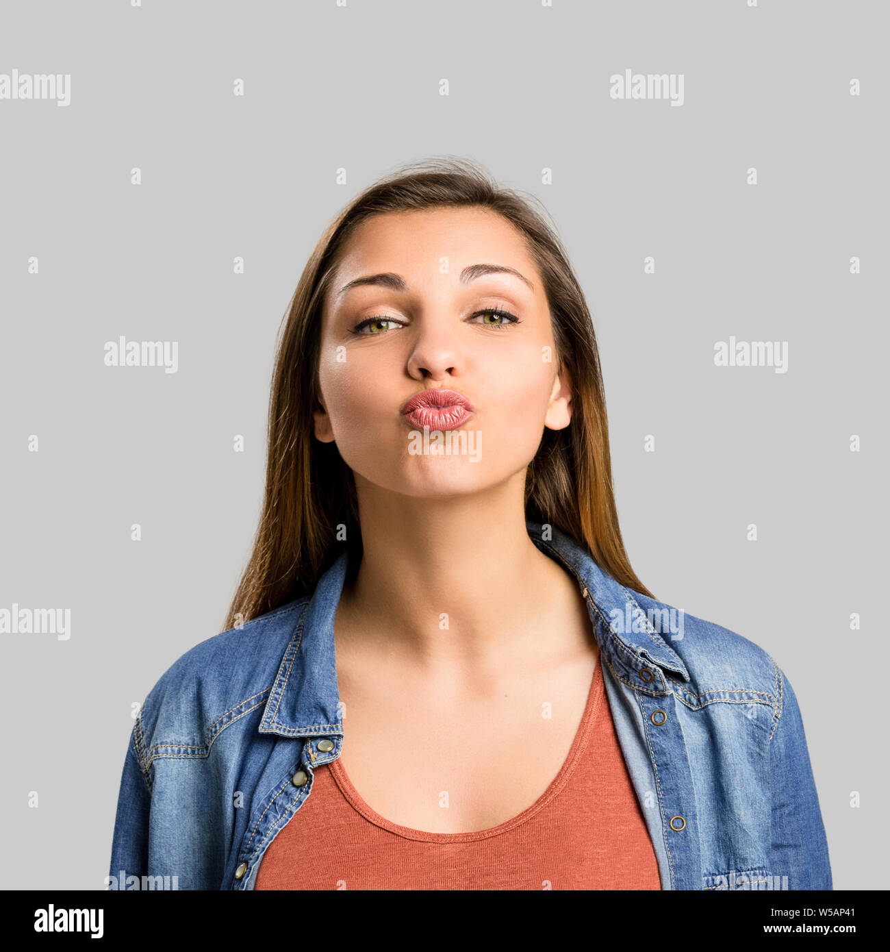 Portrait of a beautiful woman sending a kiss Stock Photo - Alamy