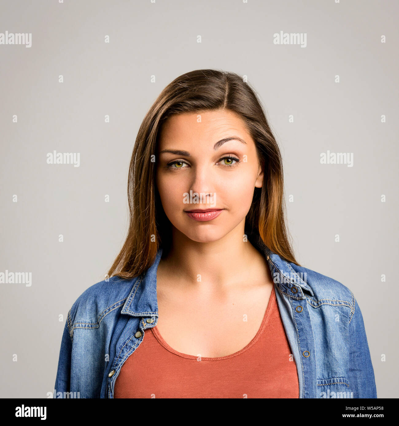 Portrait of a beautiful woman making an angelic expression Stock Photo ...