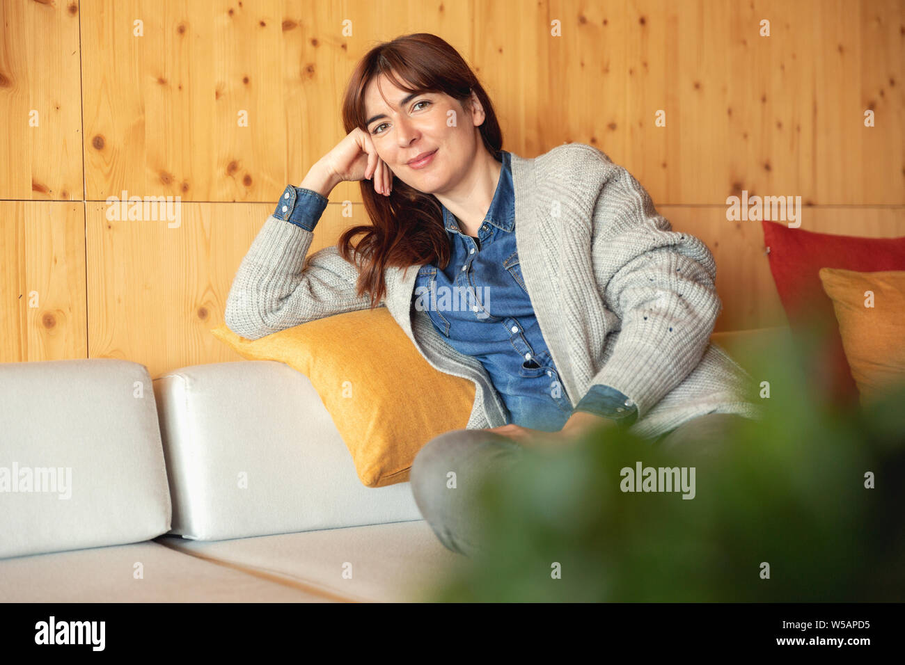 Beautiful woman sitting and relaxing Stock Photo - Alamy
