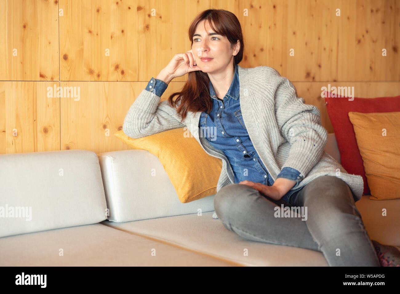 Beautiful woman sitting and relaxing Stock Photo - Alamy