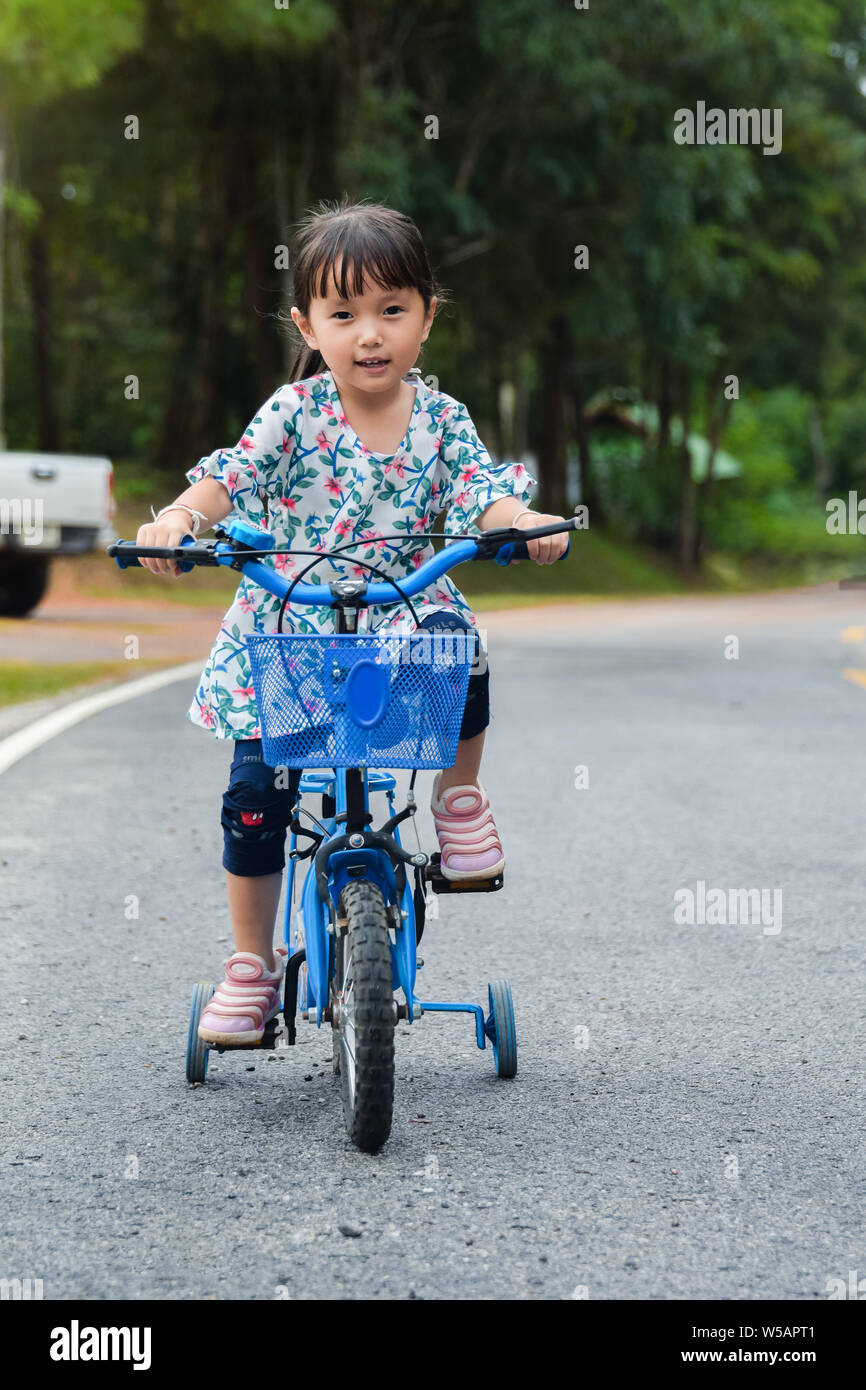Asian girl bike ride hi-res stock photography and images - Alamy