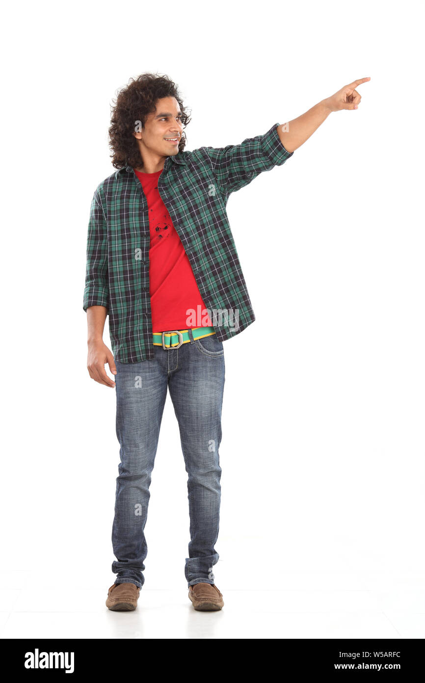 Man showing something and smiling Stock Photo - Alamy