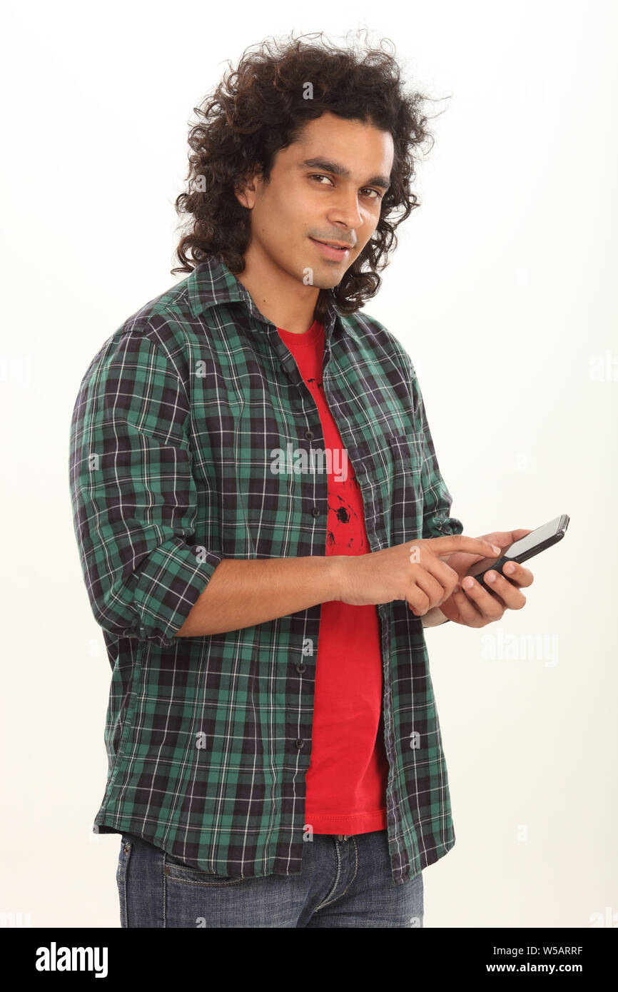 Man text messaging on a mobile phone Stock Photo - Alamy