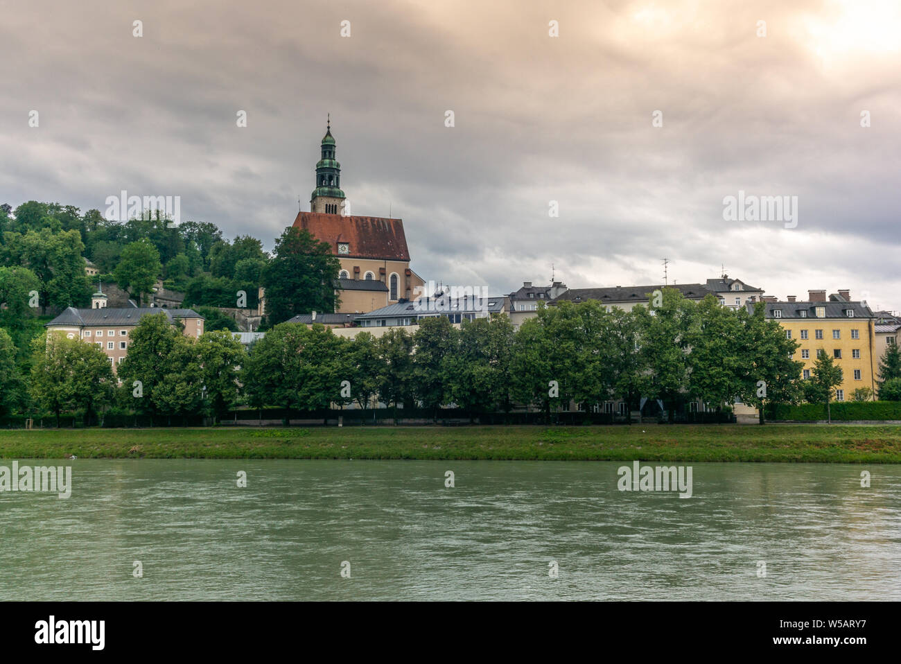 The Salzach river flowing in Salzburg in Austria and its riverside ...
