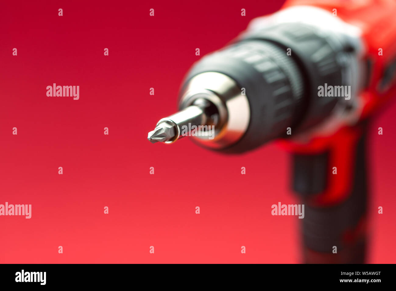 Battery screwdriver or drill on red background presentation Stock Photo ...