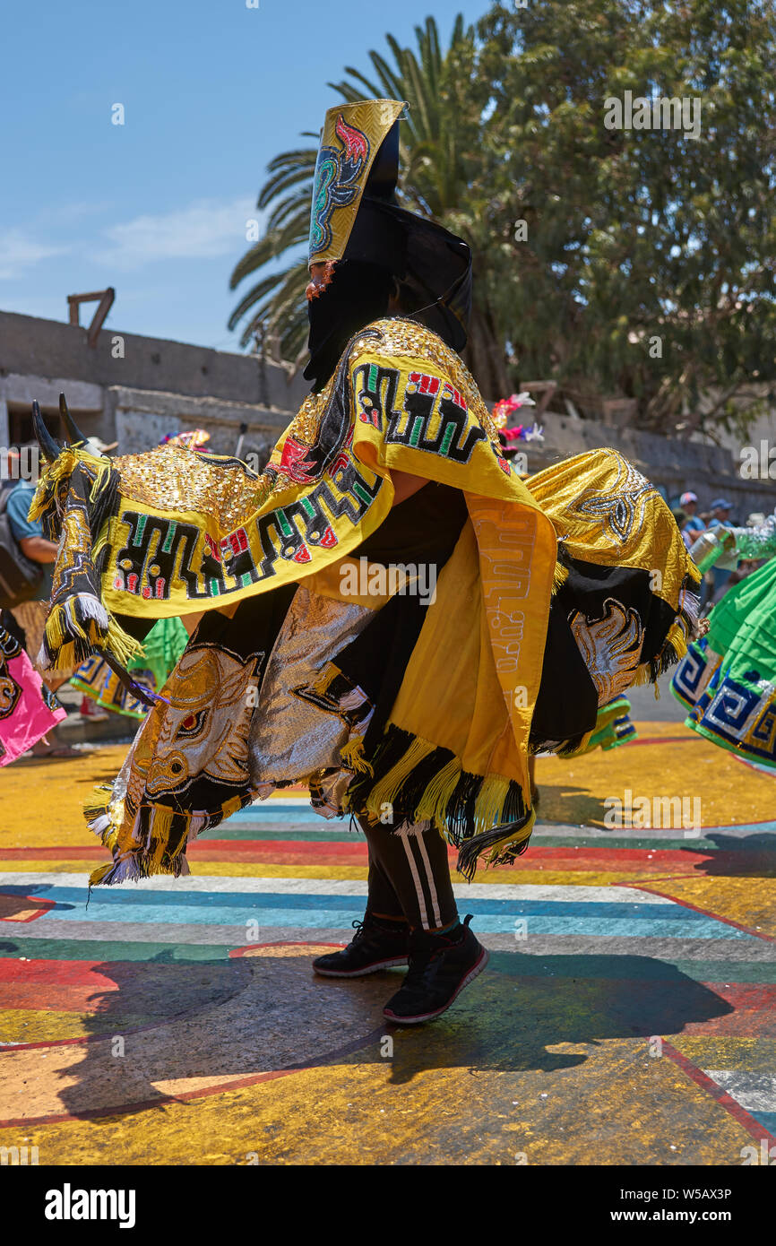 Members of a Waca Waca dance group in ornate costume performing at the ...