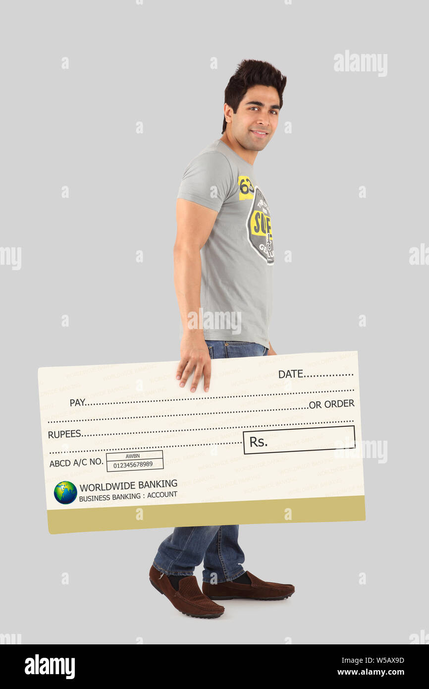 Man holding bank cheque Stock Photo - Alamy