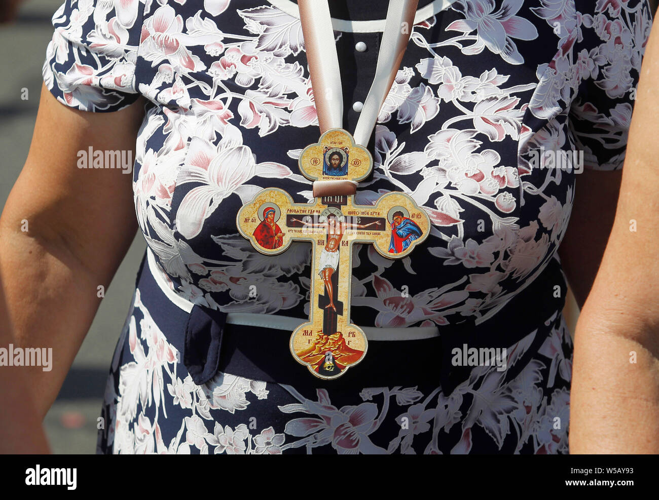 Orthodox believer with a crucifixion cross during the procession ...