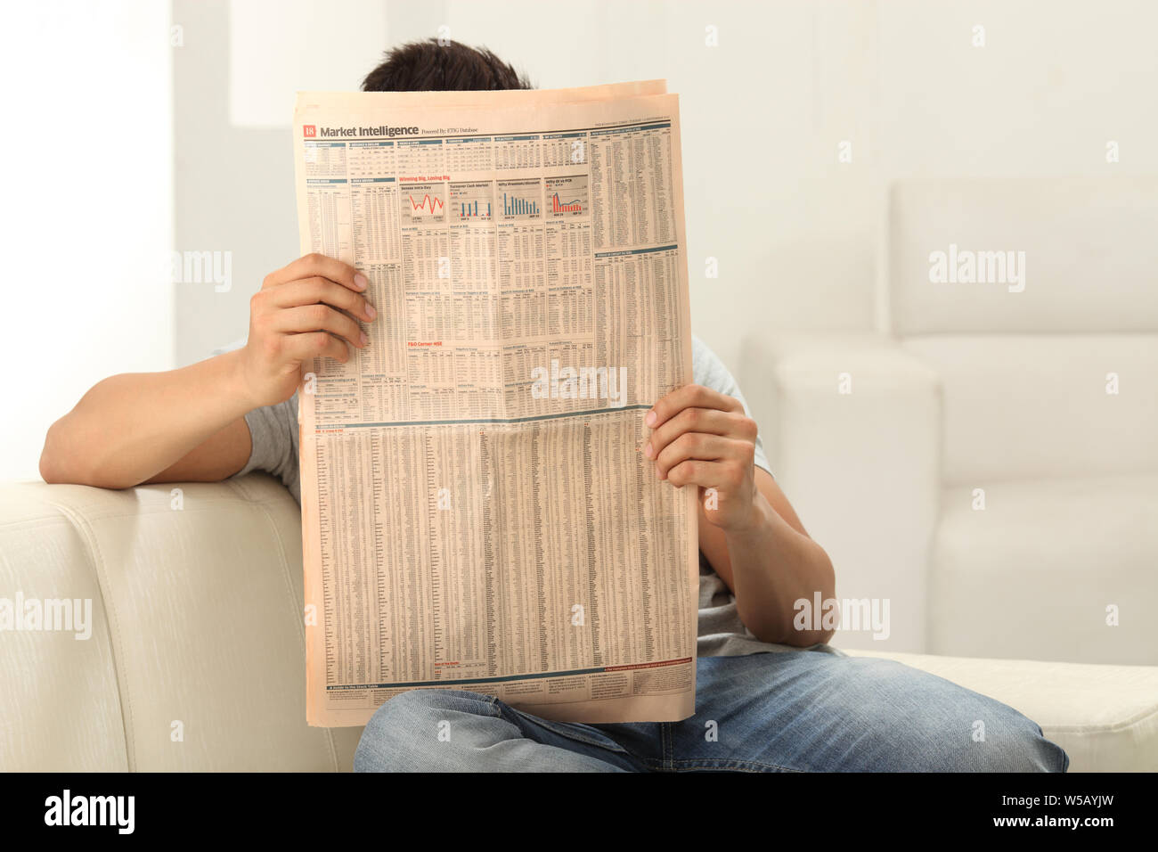 Man reading a newspaper Stock Photo - Alamy