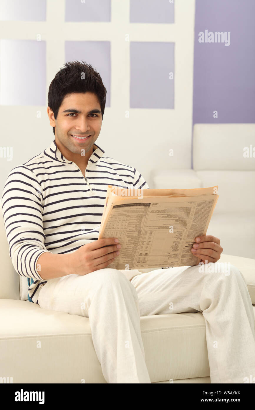 Man reading a newspaper Stock Photo - Alamy