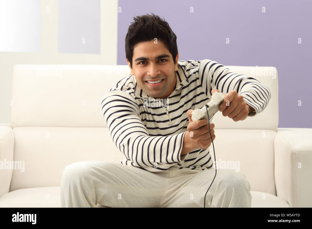 Indian man game controller hi-res stock photography and images - Alamy