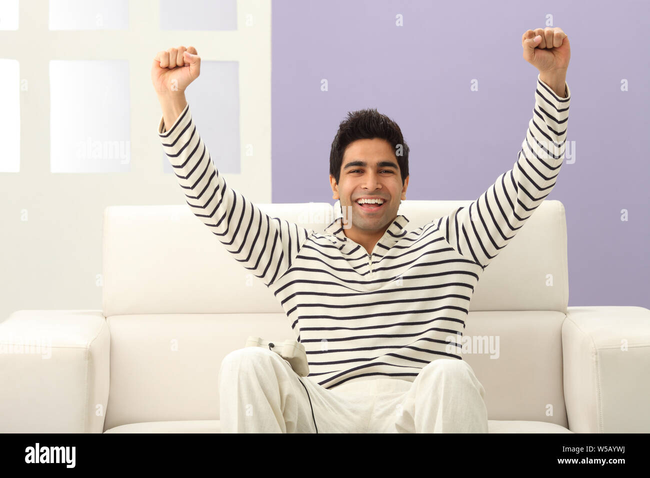 Man celebrating and cheering Stock Photo - Alamy