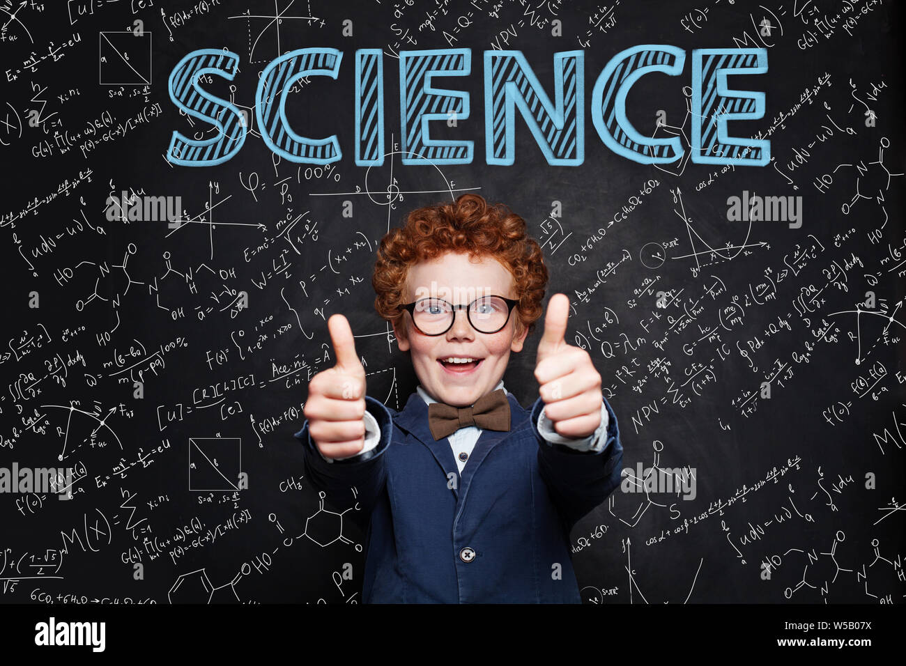 The day i passed science. Happy young boy having fun against science ...