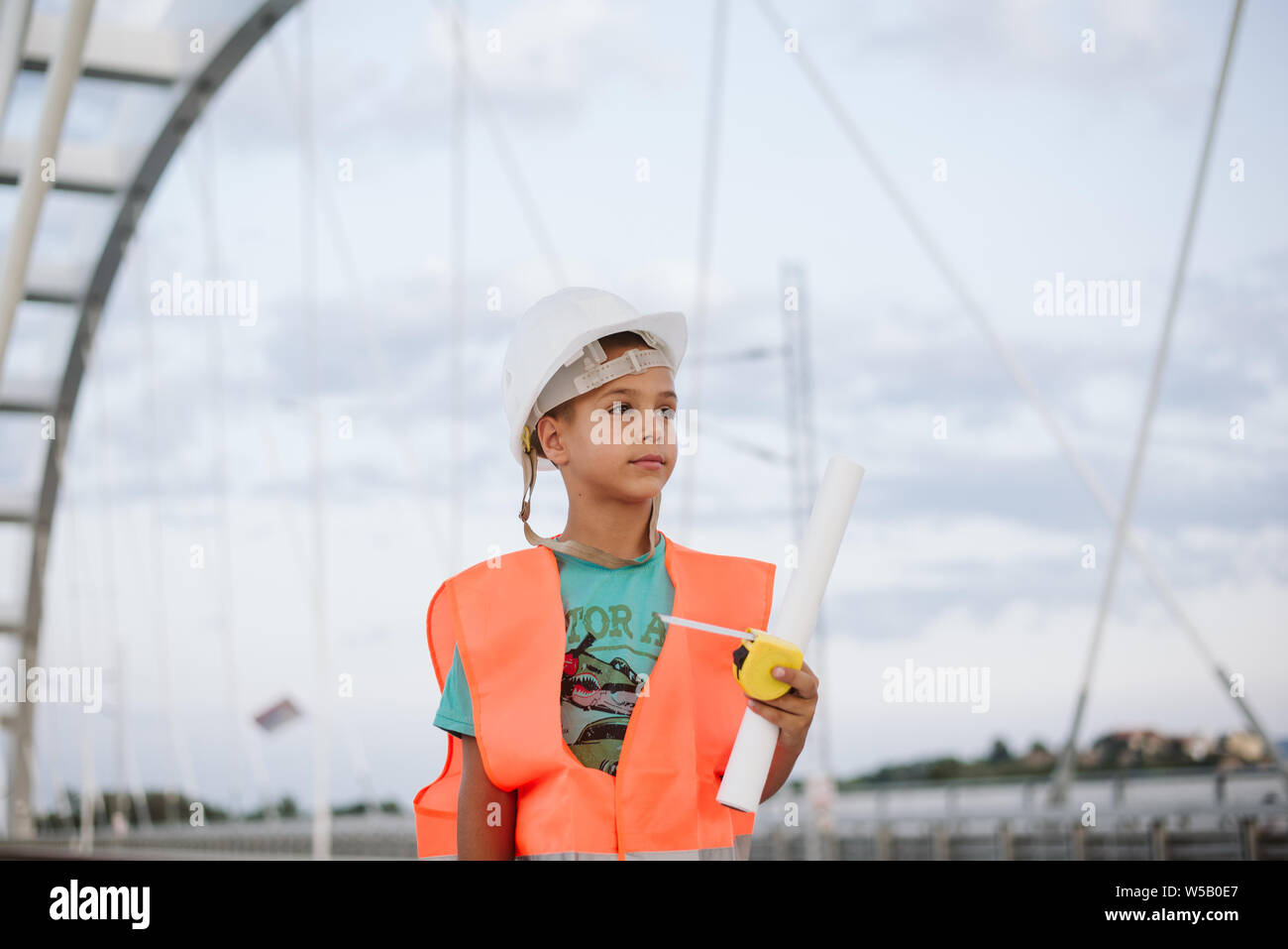 Cute boy engineer on bridge Stock Photo - Alamy