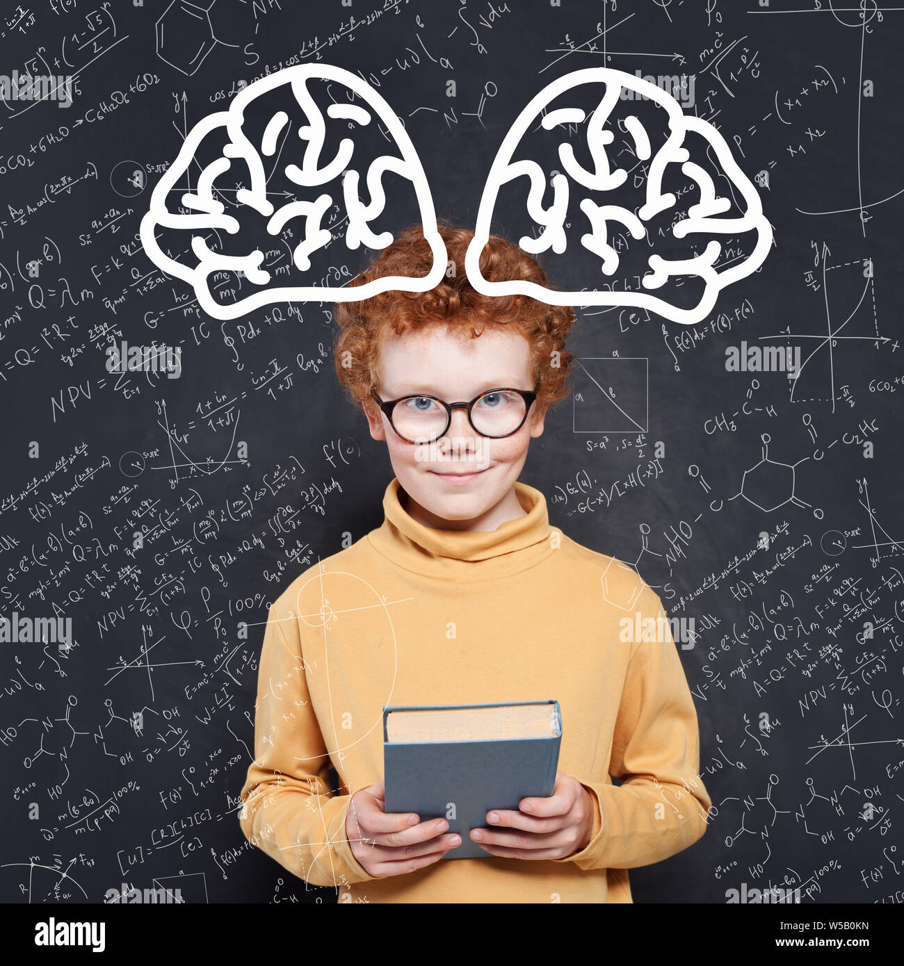 Happy smart school boy with ginger hair on science background. Learn ...
