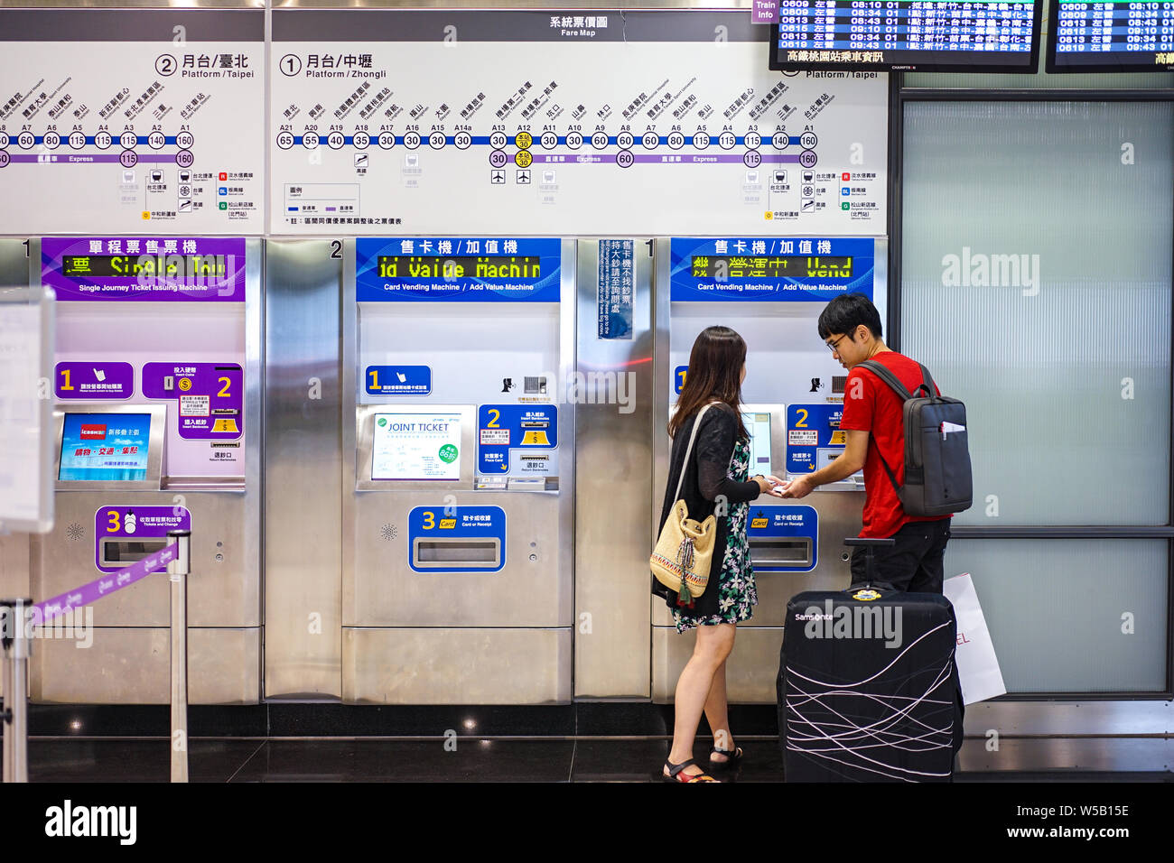 Taipei, TAIWAN - 1 Oct, 2017: Travelers buy a train ticket from card ...
