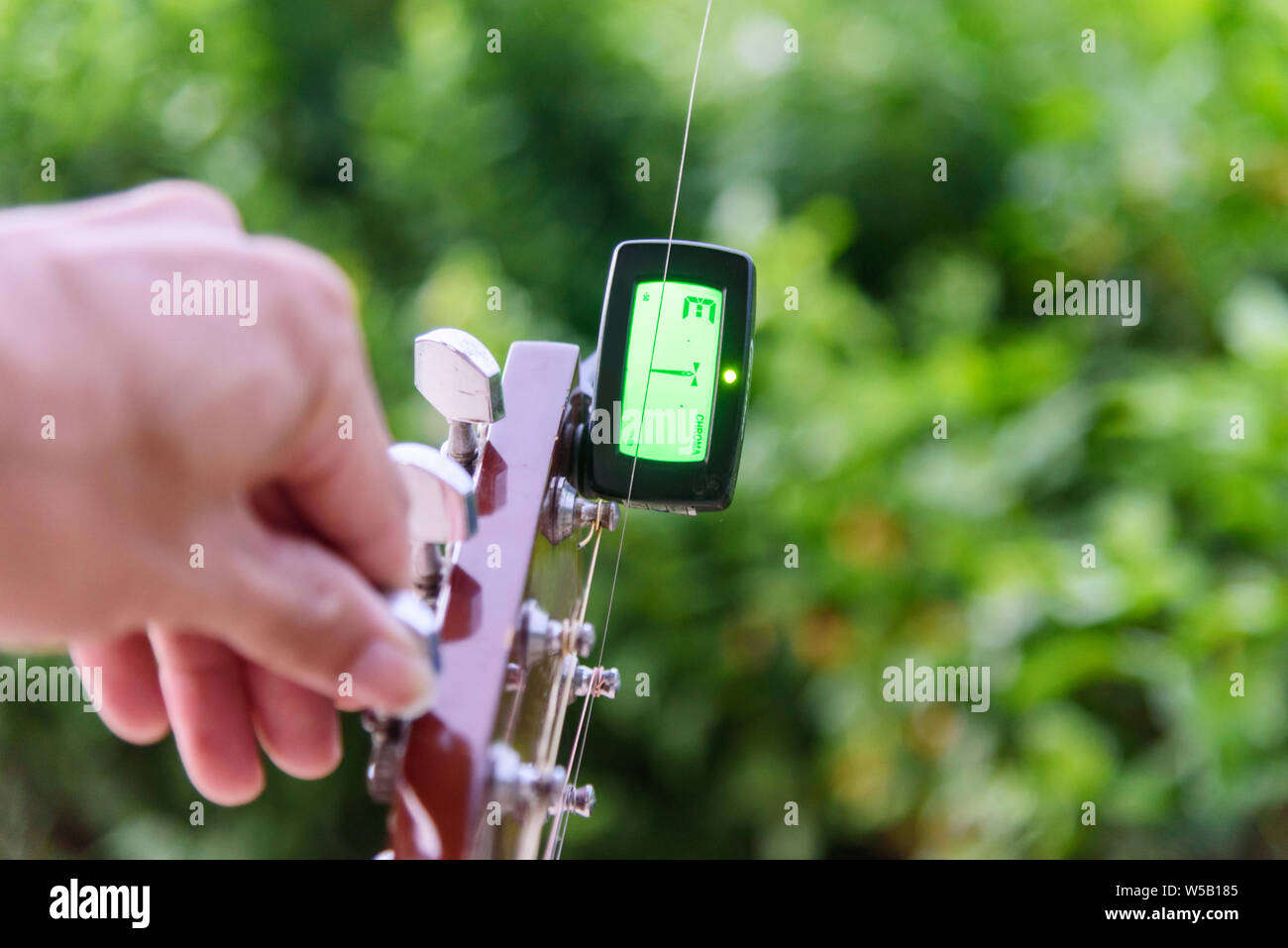 guitar tuners tool / tuning guitar strings notes Stock Photo - Alamy