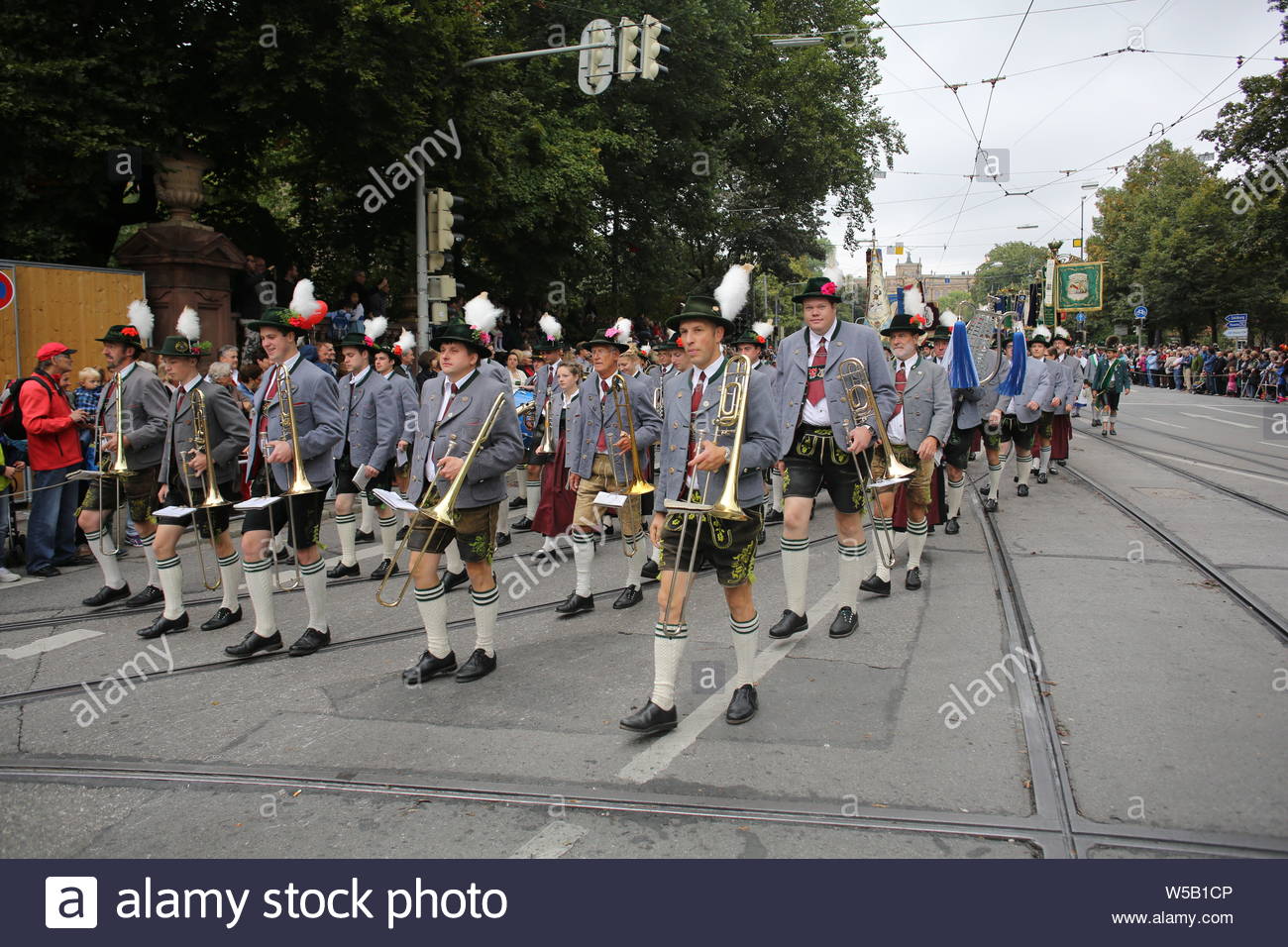 The Oktoberfest parade sees groups in uniform or traditional Bavarian ...