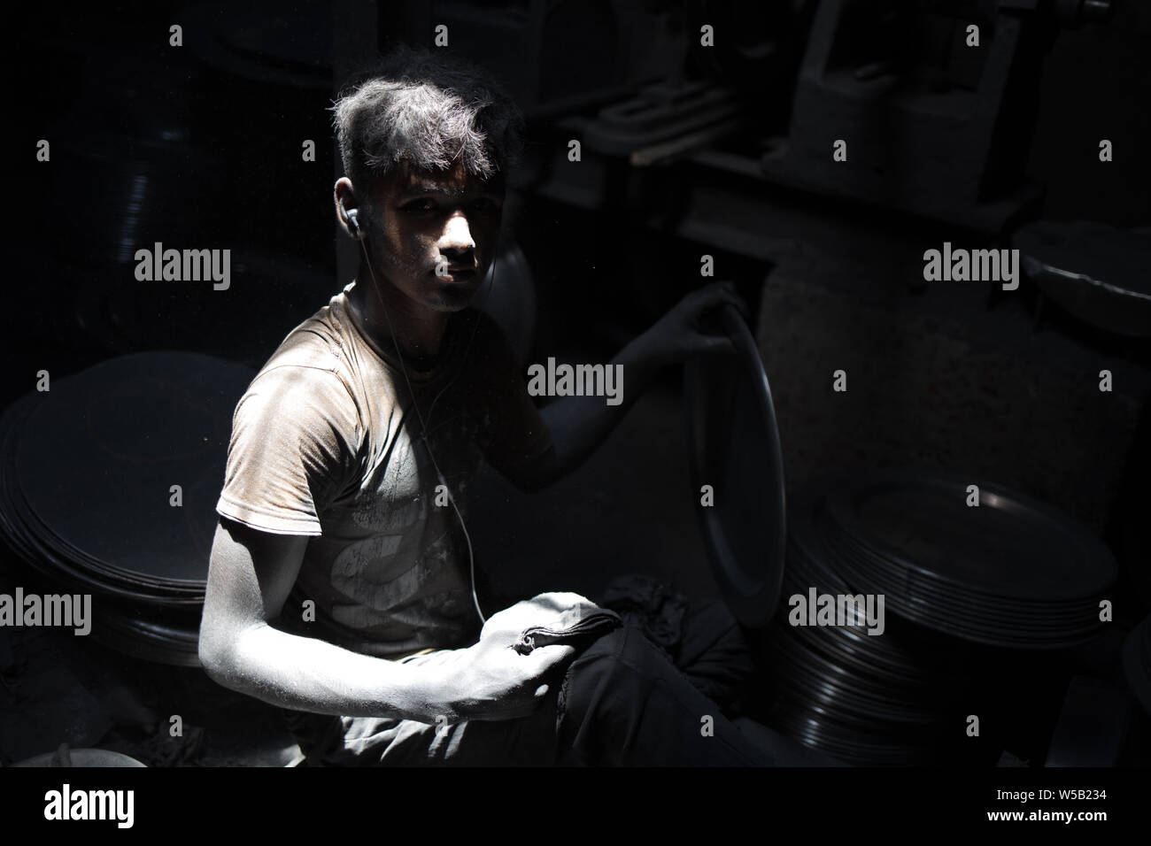 Child Labor - An under age boy working in a silver factory in Dhaka ...